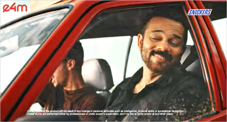 A hangry Rohit Shetty flips cars in Snickers ad